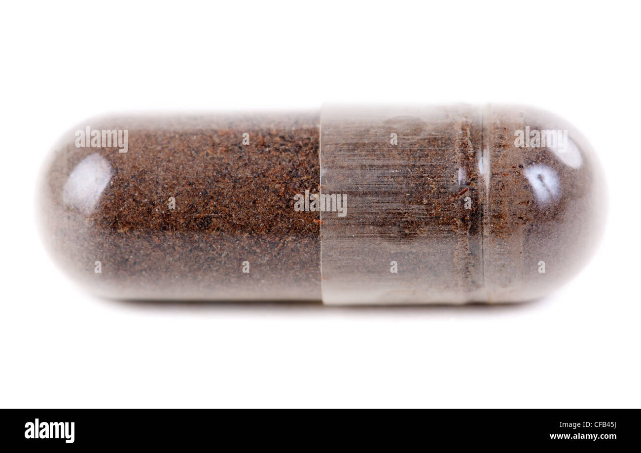 One pill is a close-up isolated on white background Stock Photo - Alamy