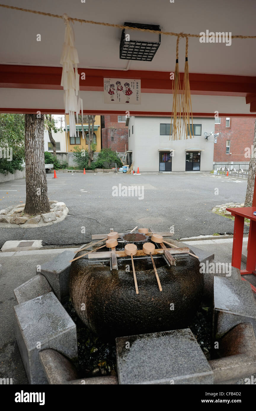 stone bowl for water purification rite at Ikuta shrine, Kobe, Japan ...