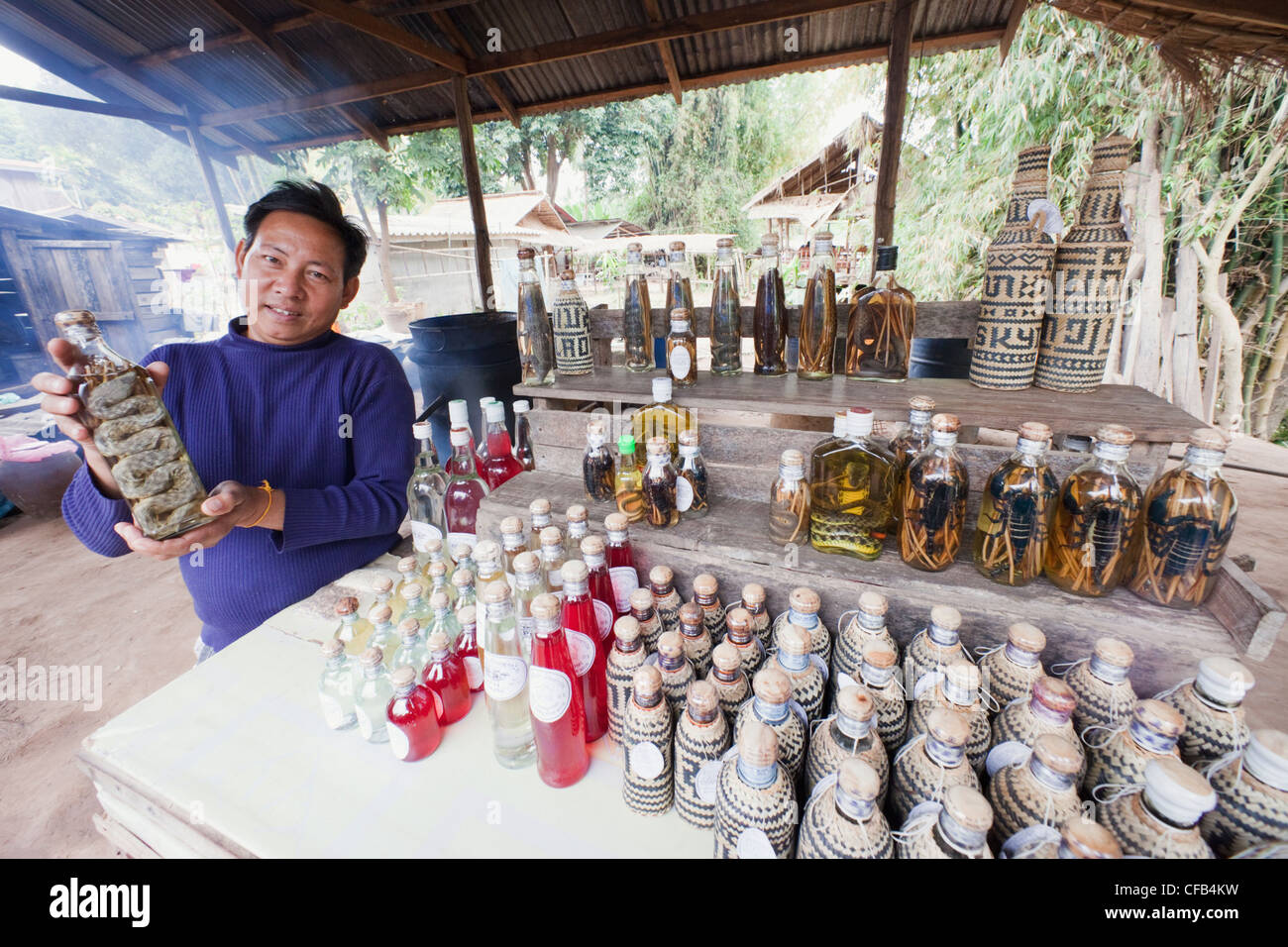 Laos, Luang Prabang, Ban Xang Hai Village, Man Selling Locally Made Lao ...