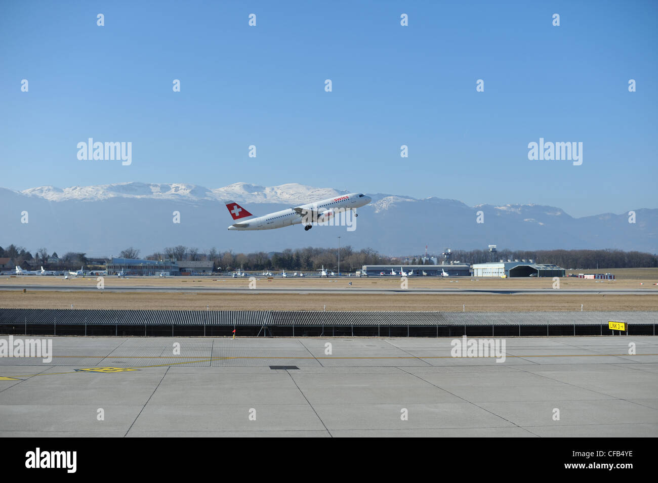 swiss air airbus a320 taking off in the alps at geneva switzerland ...