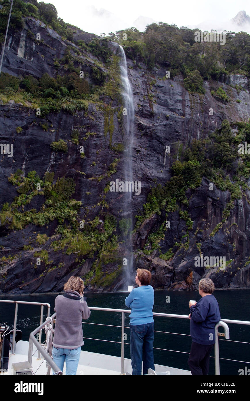 New Zealand, South Island, waterfall seen cruising on Milford Sound ...
