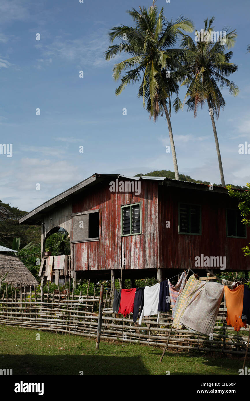 Traditional native Iban and Dayak family in a longhouse in Borneo ...