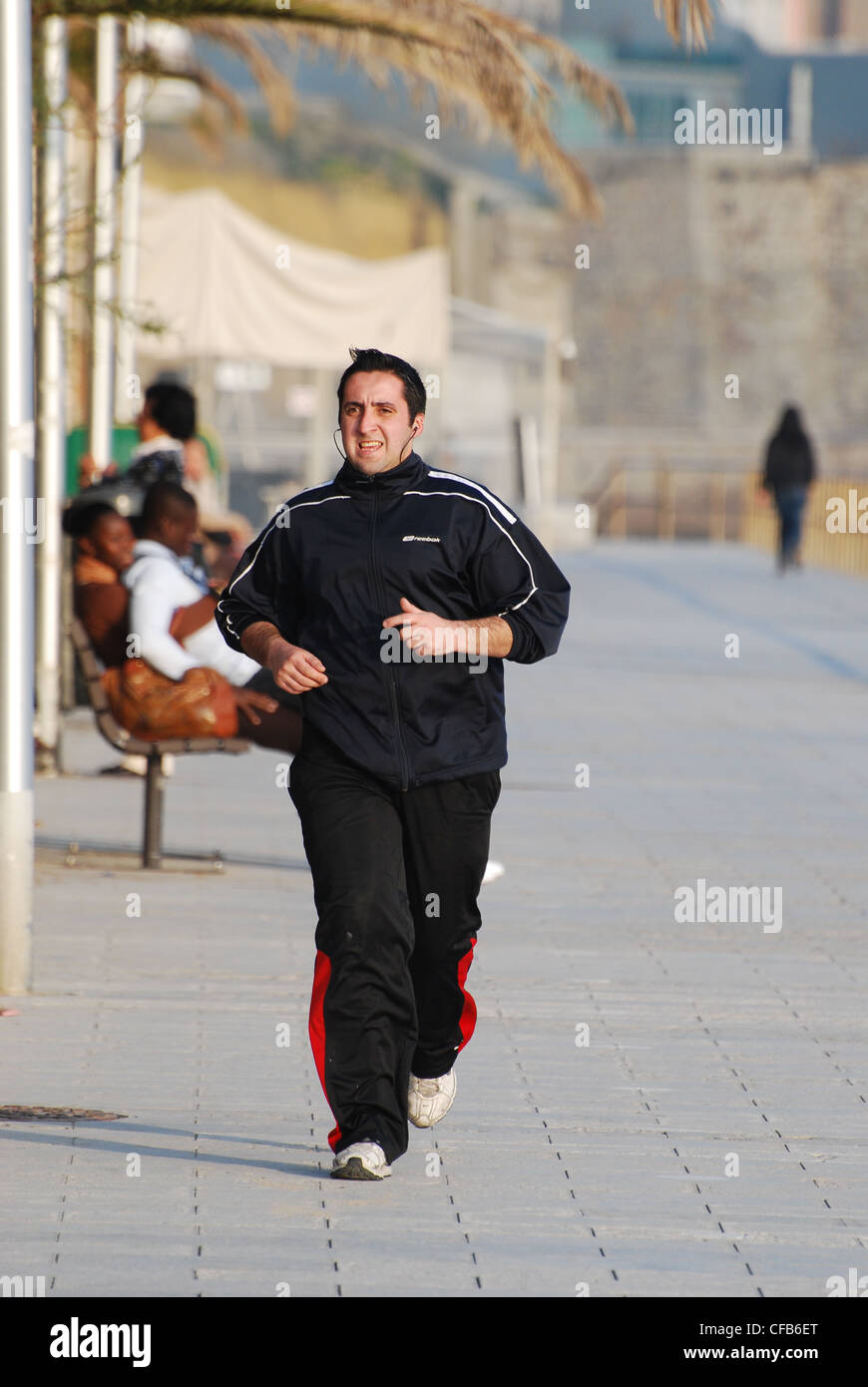a man running jogging to keep fit Stock Photo - Alamy