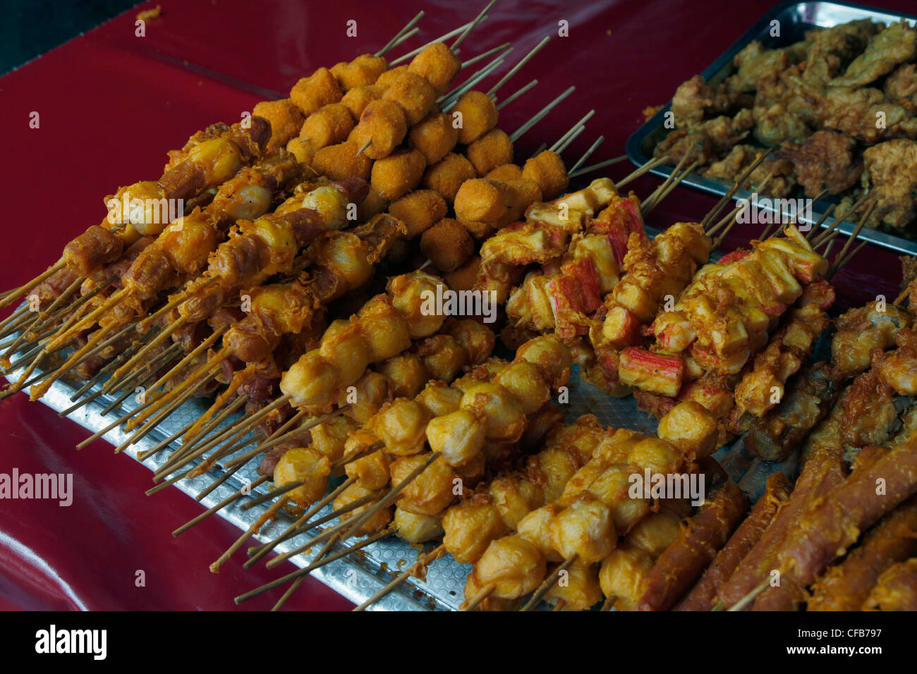 Snacks cooked in palm oil at a food stall in Kuala Lumpur, Malaysia ...