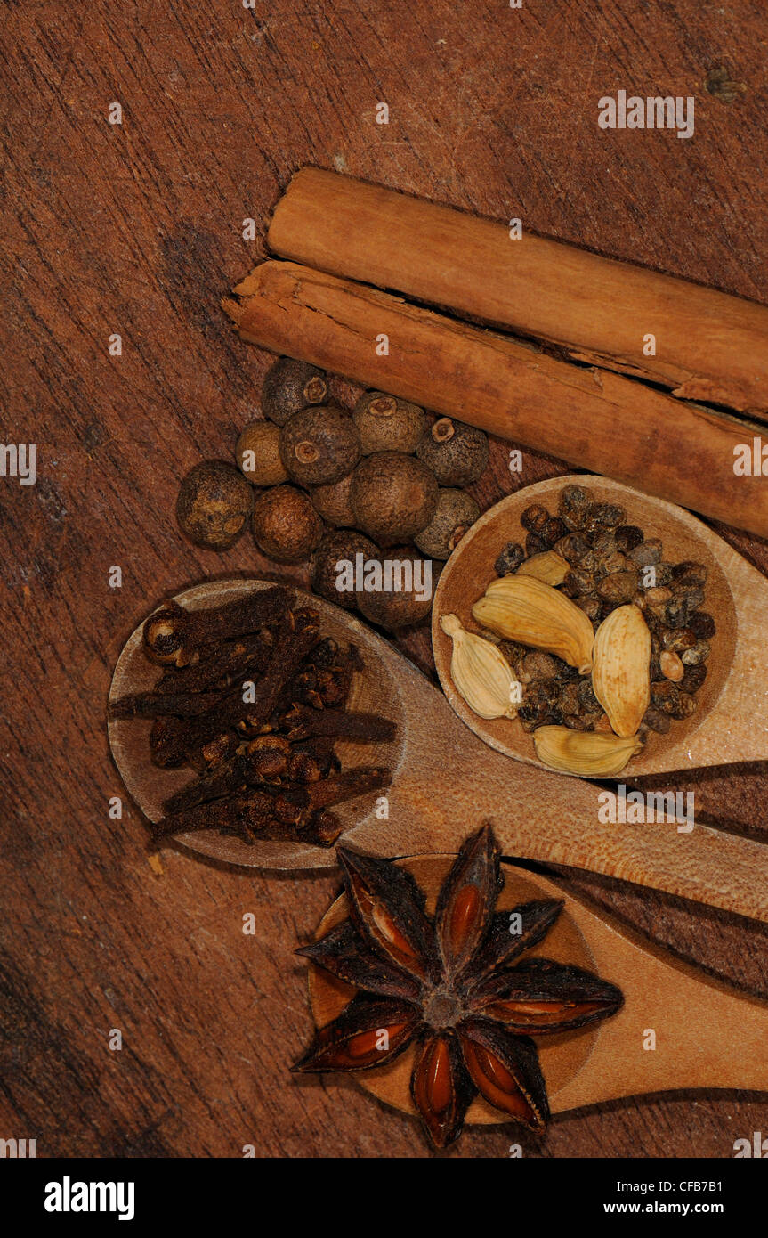 Background with assorted spices: cinnamon, cardamom, black pepper ...