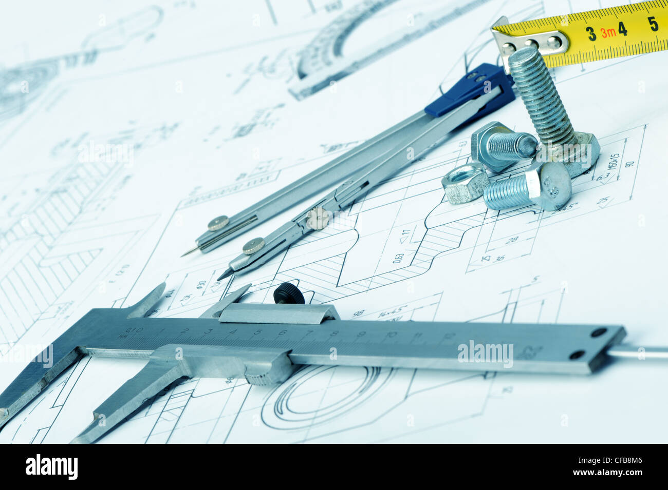 The plan industrial details, a screws, caliper, divider. A photo ...