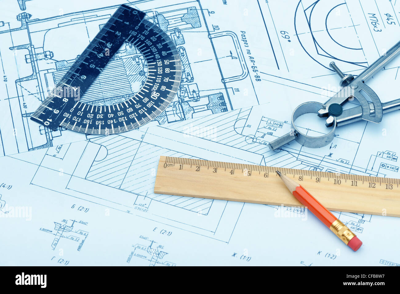 The plan industrial details, a protractor, caliper, divider and a red ...