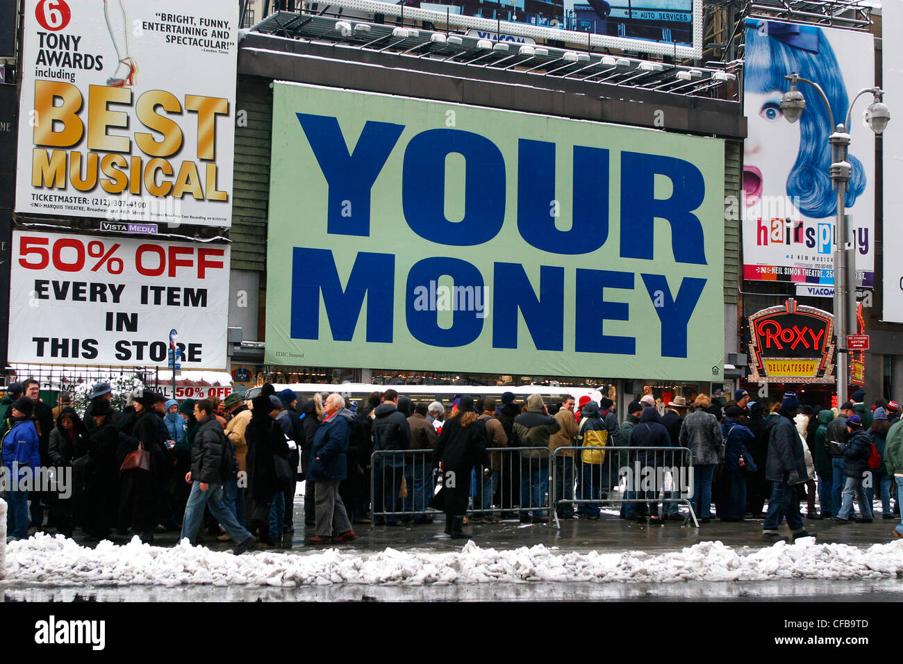 "Your Money" sign over the crowds on Times square, New York City, USA ...