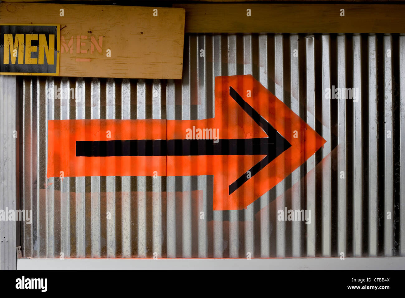 Arrow sign on a metal grate, Miami, USA Stock Photo - Alamy