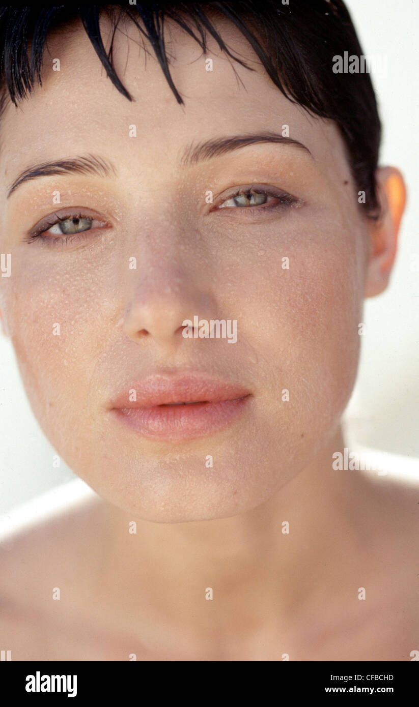 Female wet black hair and short fringe wearing lipgloss smudged mascara ...