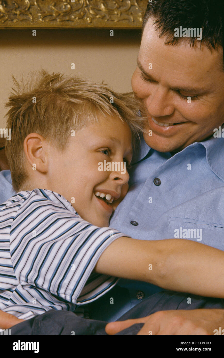 Father short brown hair wearing short sleeved blue shirt male child ...
