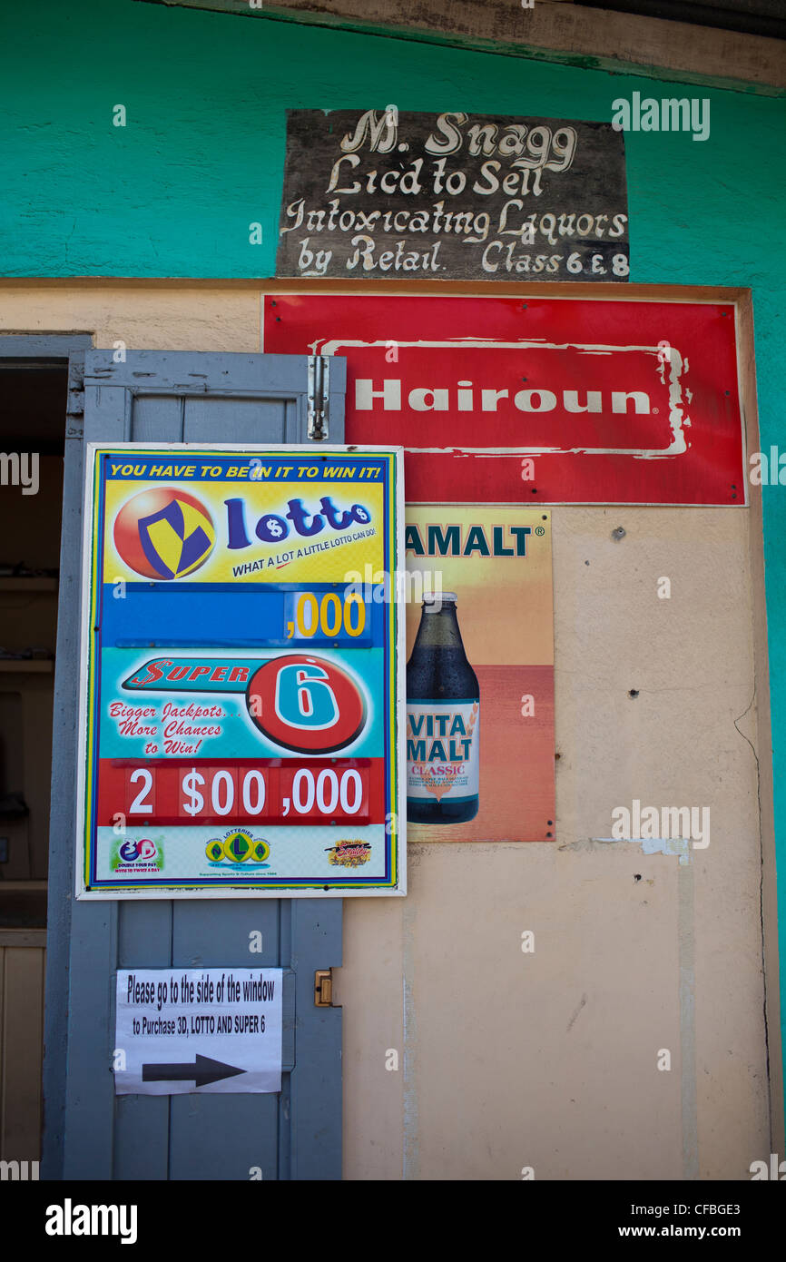 A store front sign advertises lottery tickets in Clifton, Union Island ...