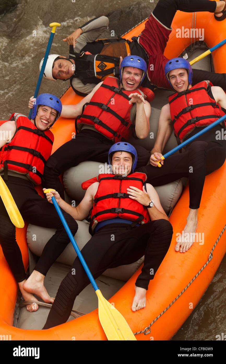Group Of Happy Guys After Descending On A Rafting Boat Stock Photo - Alamy