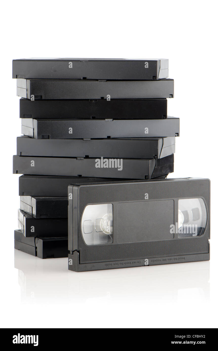 Pile of videotapes on white reflective background Stock Photo - Alamy