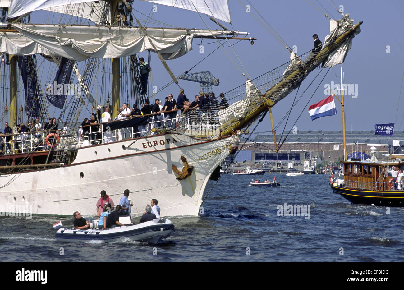 Boats entering Amsterdam harbor during the SAIL 2005 maritime event ...