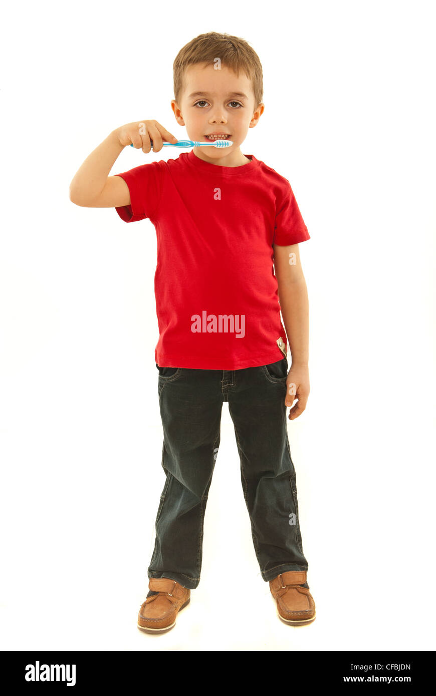 Full length of small boy holding toothbrush isolated on white ...