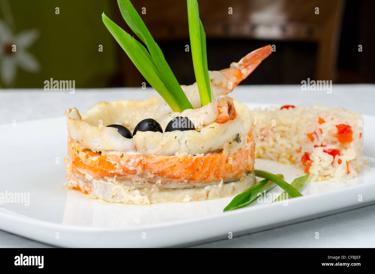tasty prepared fish with rice and vegetables Stock Photo - Alamy