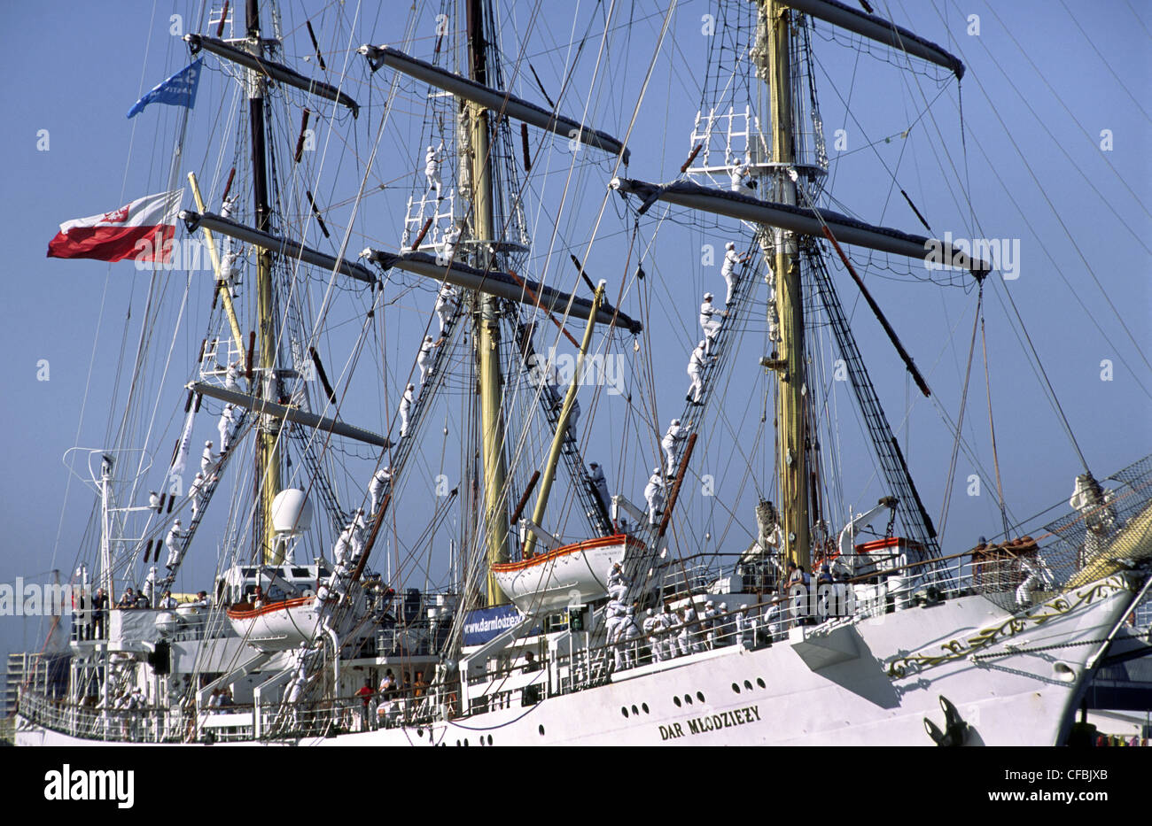 Crew climbing the rigging of Polish sail ship "Dar Mlodziezy" during ...