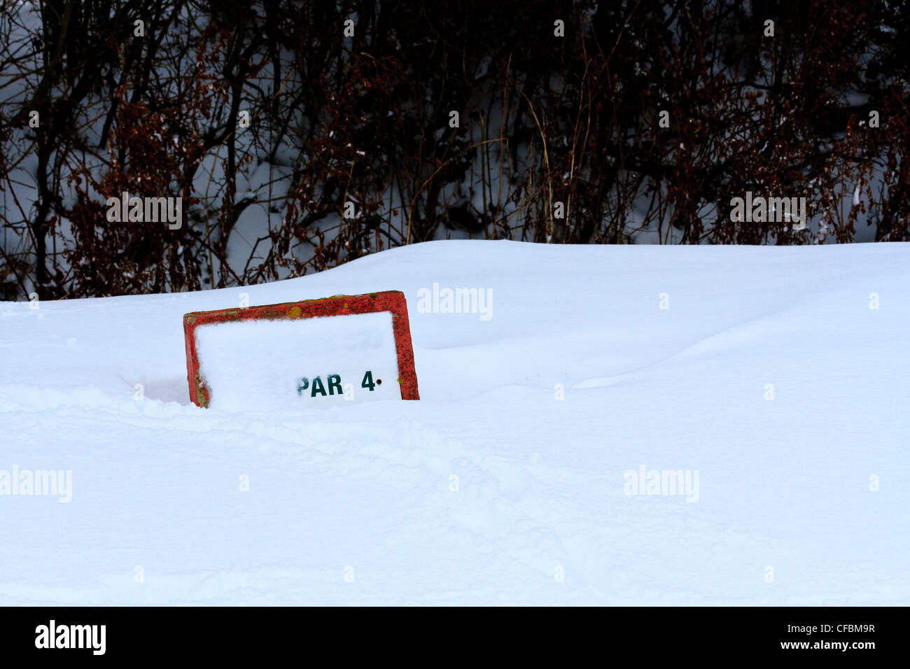 Snow covered par 4 sign on a golf course Stock Photo - Alamy