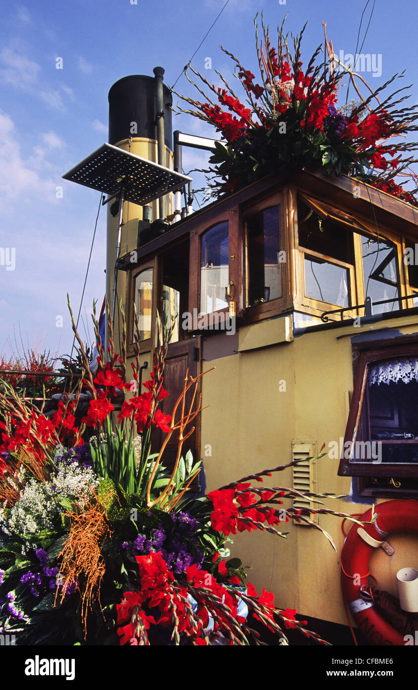 Dutch tugboat decorated with flowers, SAIL 2005. Amsterdam, The ...
