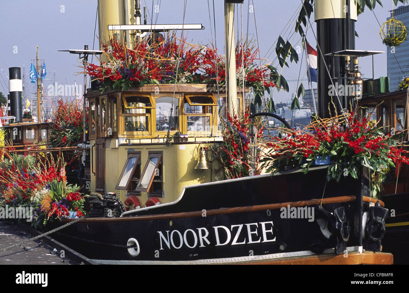Dutch tugboat decorated with flowers, SAIL 2005. Amsterdam, The ...