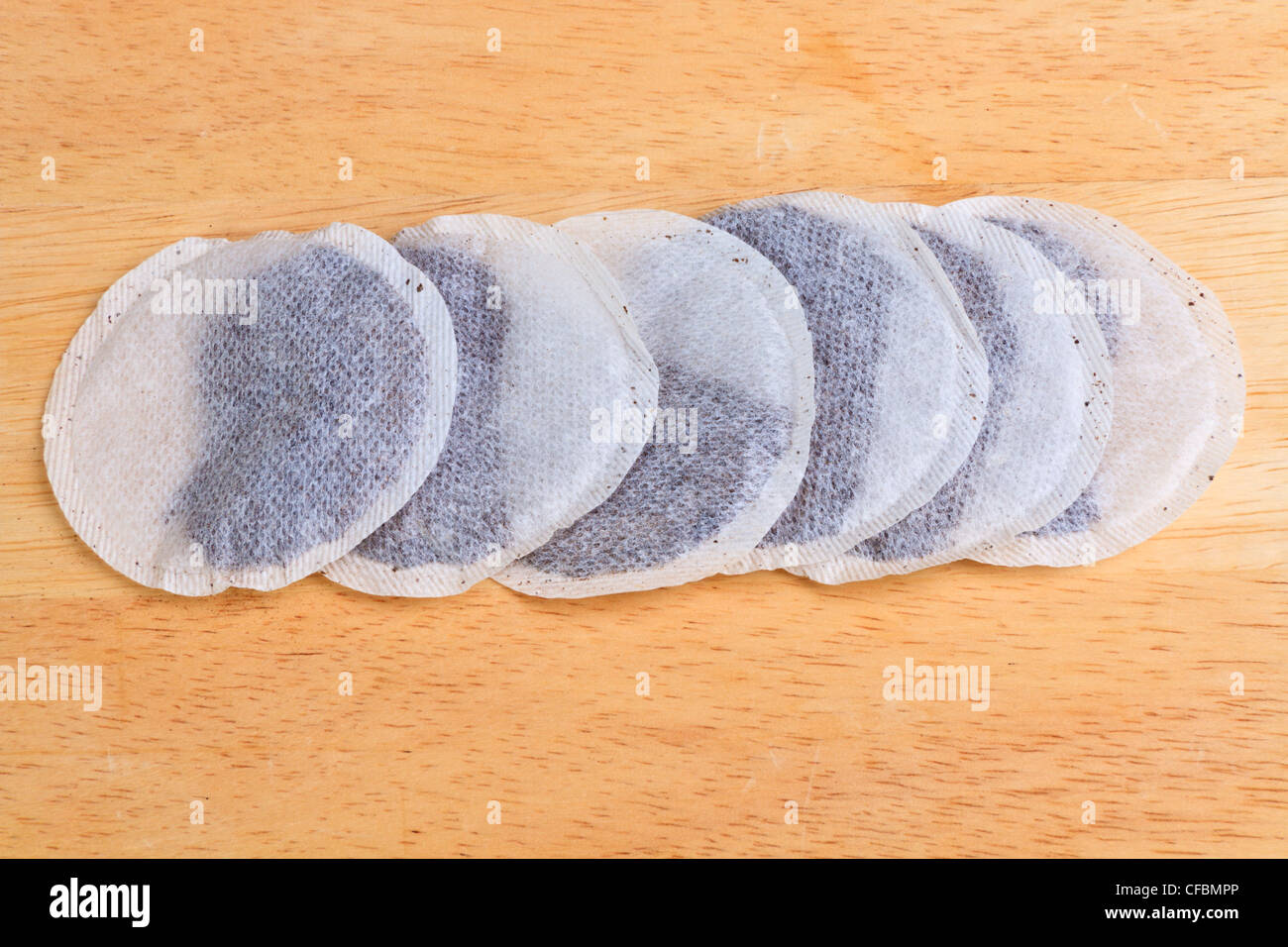 Tea bags on a wooden block Stock Photo - Alamy