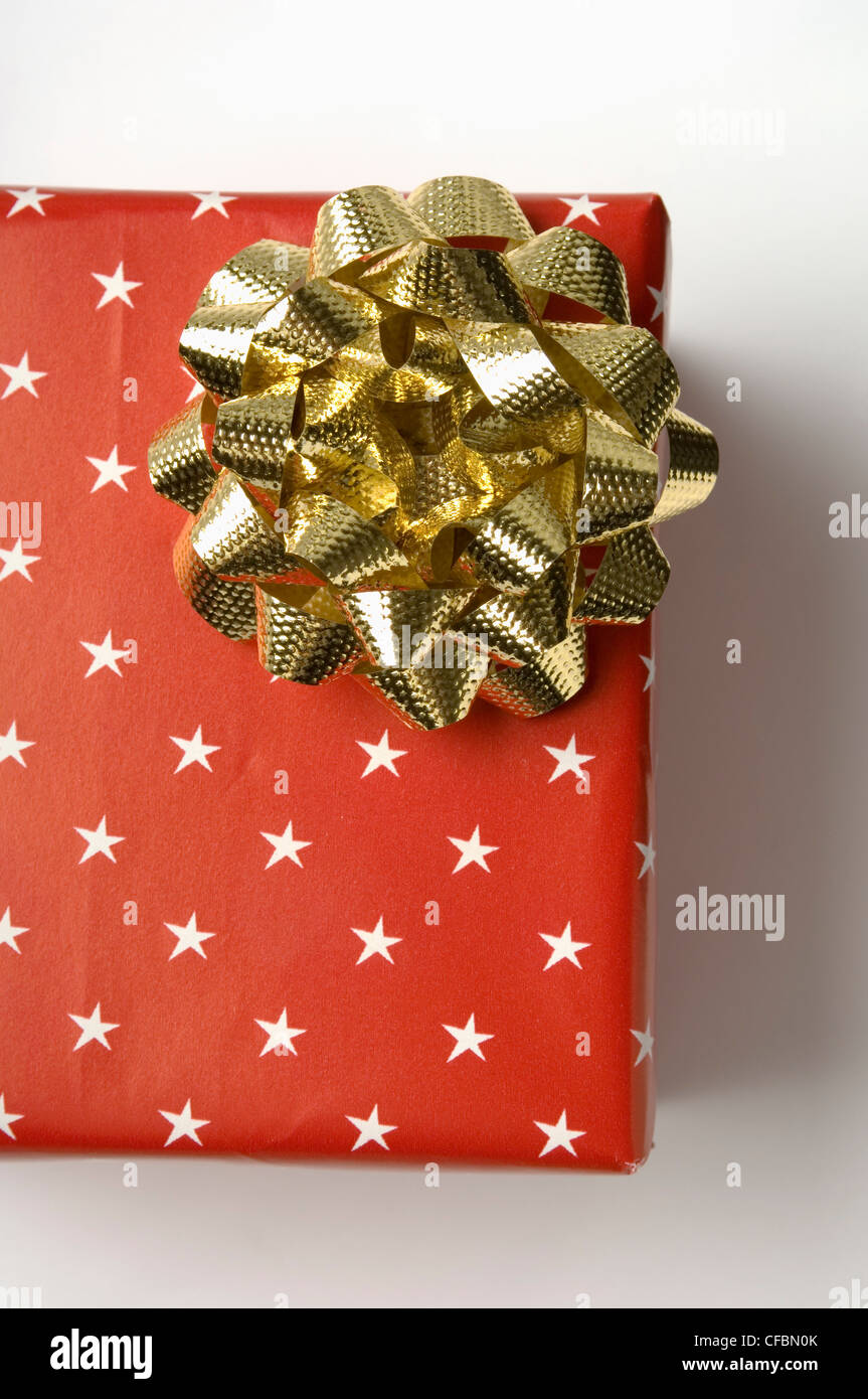 Christmas present gold red cut out hi-res stock photography and images ...