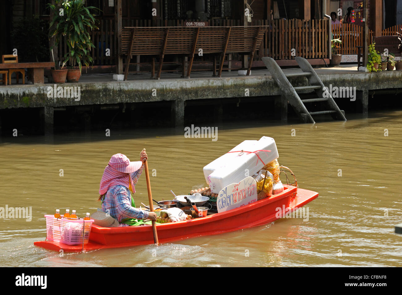 vendor selling goods from boat in canal, Amphawa, Thailand Stock Photo ...