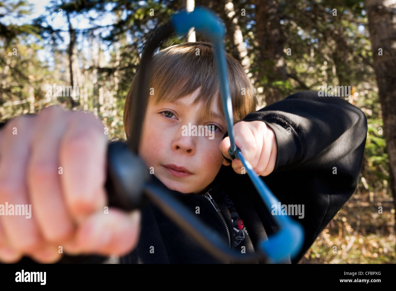 Boy aiming with slingshot hi-res stock photography and images - Alamy