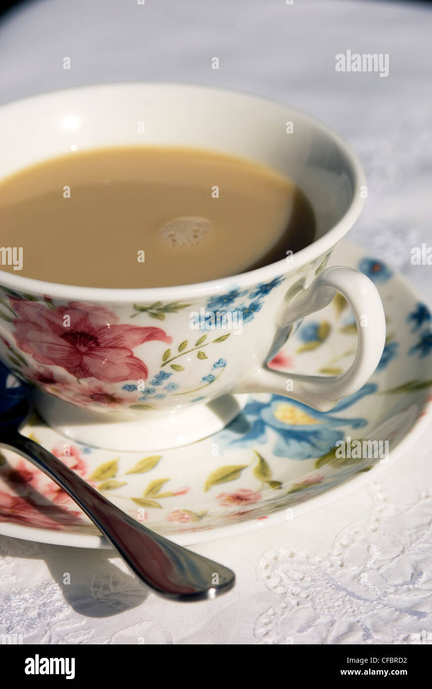 An English cream teaCup of tea in a floral cup and saucer Stock Photo ...