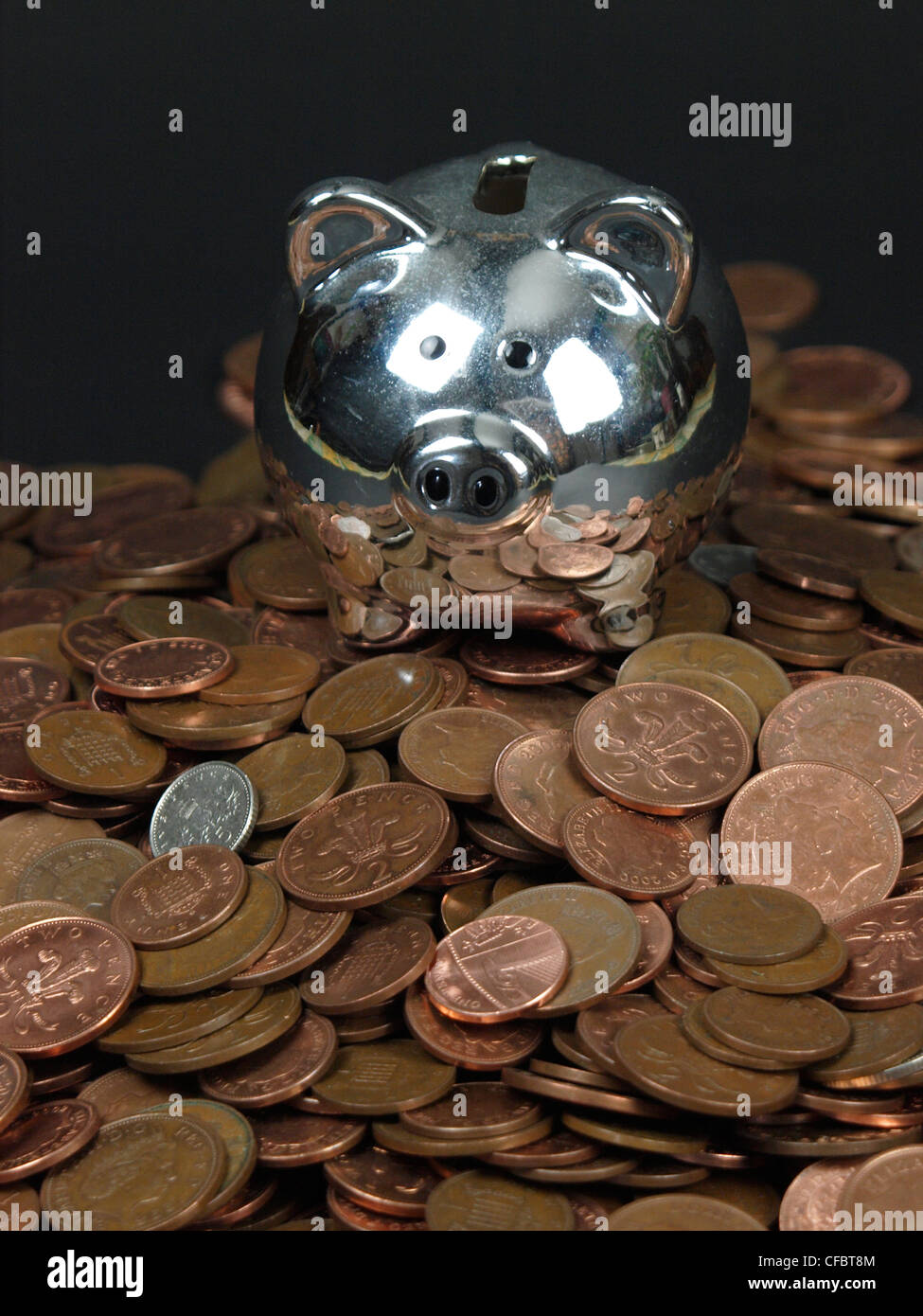 Coins in piggy bank hi-res stock photography and images - Alamy