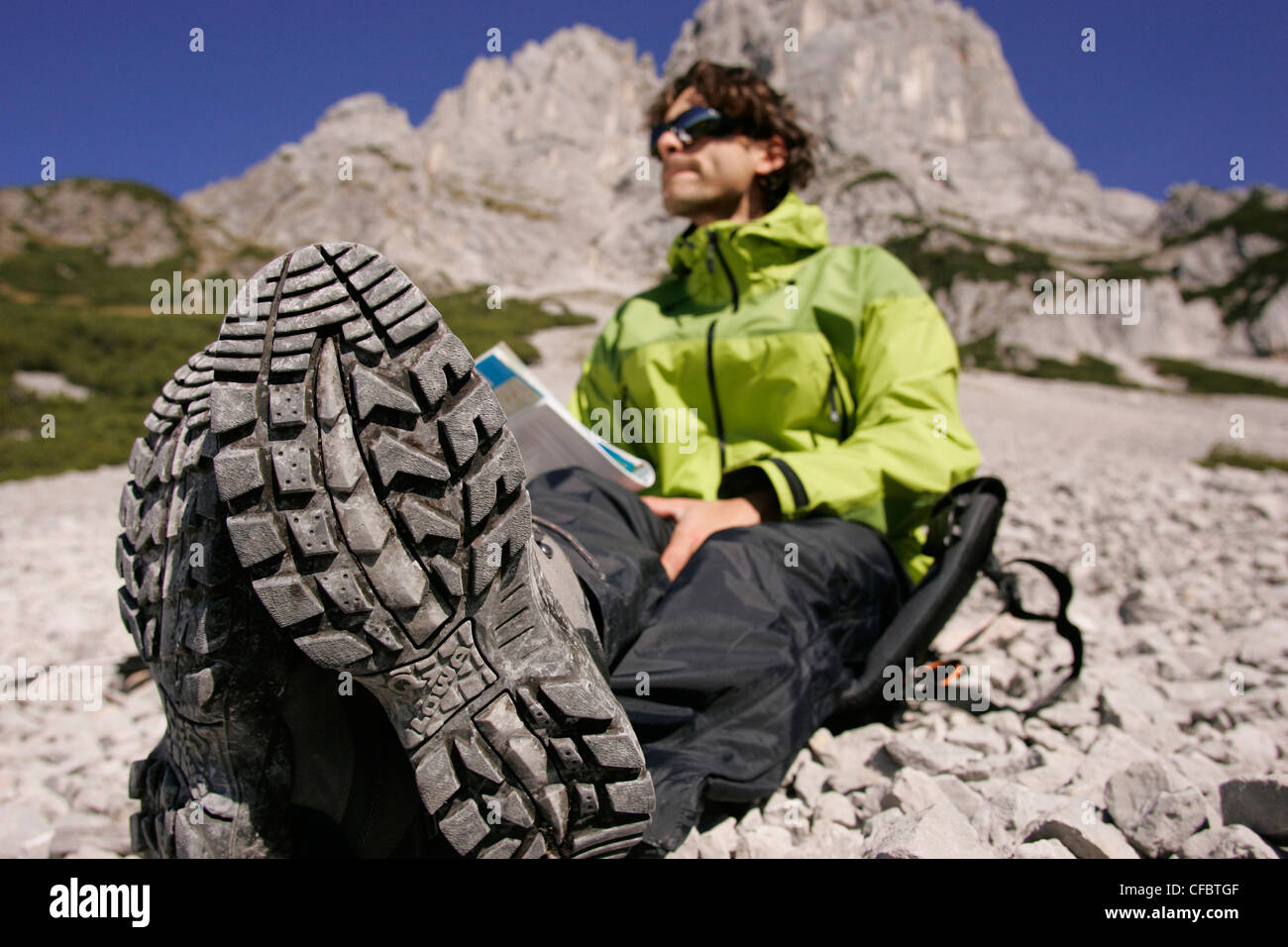 Man, sit, stone waste dump, stone, shoes, shoe profile, map, Alpine ...