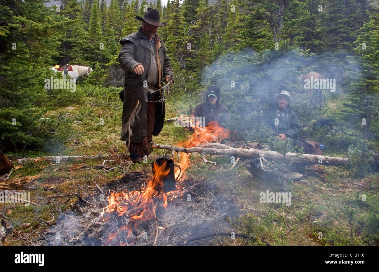 Camp fire on a trail ride through the Itcha Mountains in British ...