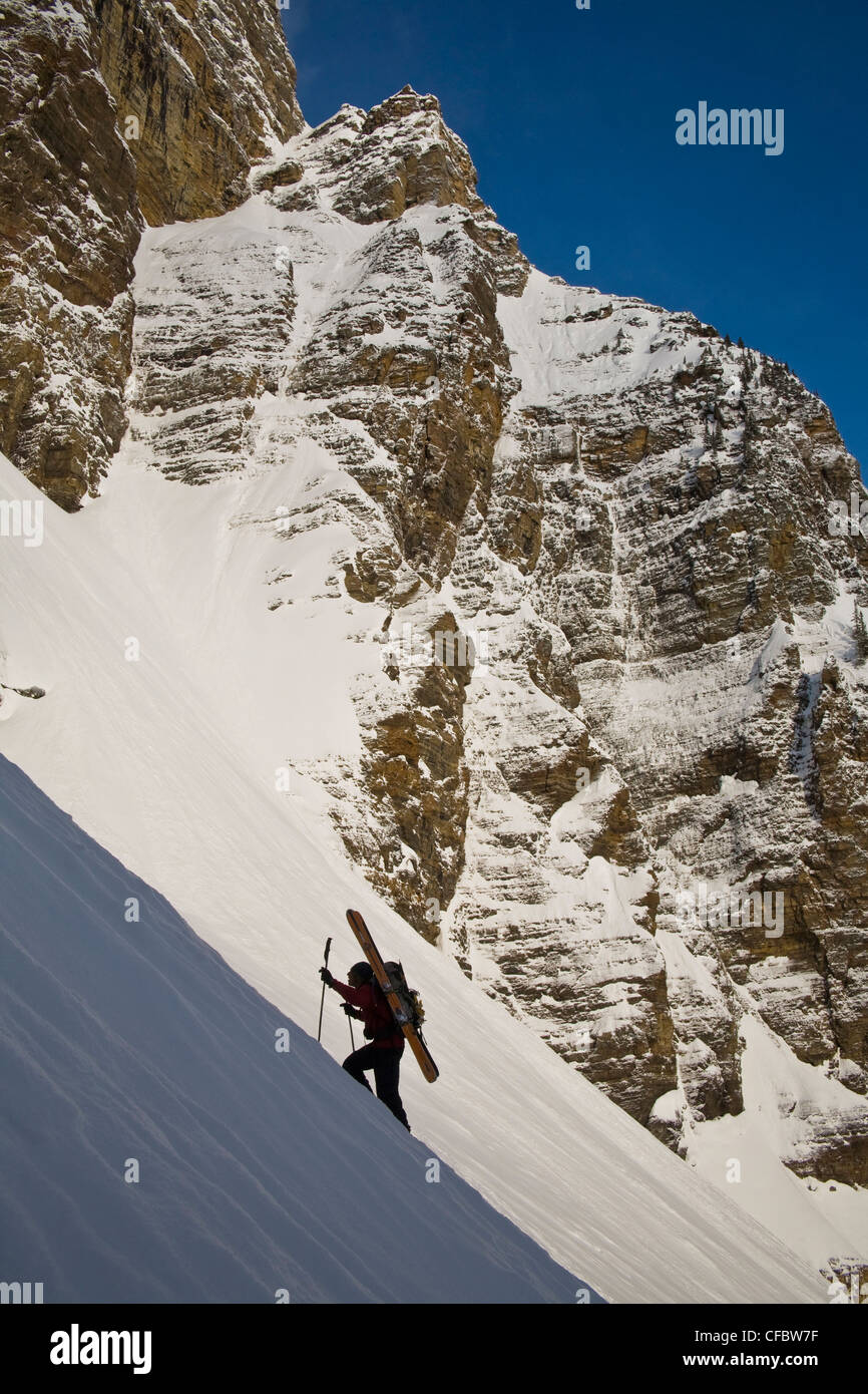 A backcountry skier hiking with ski gear, Mount Chephren, Icefields ...