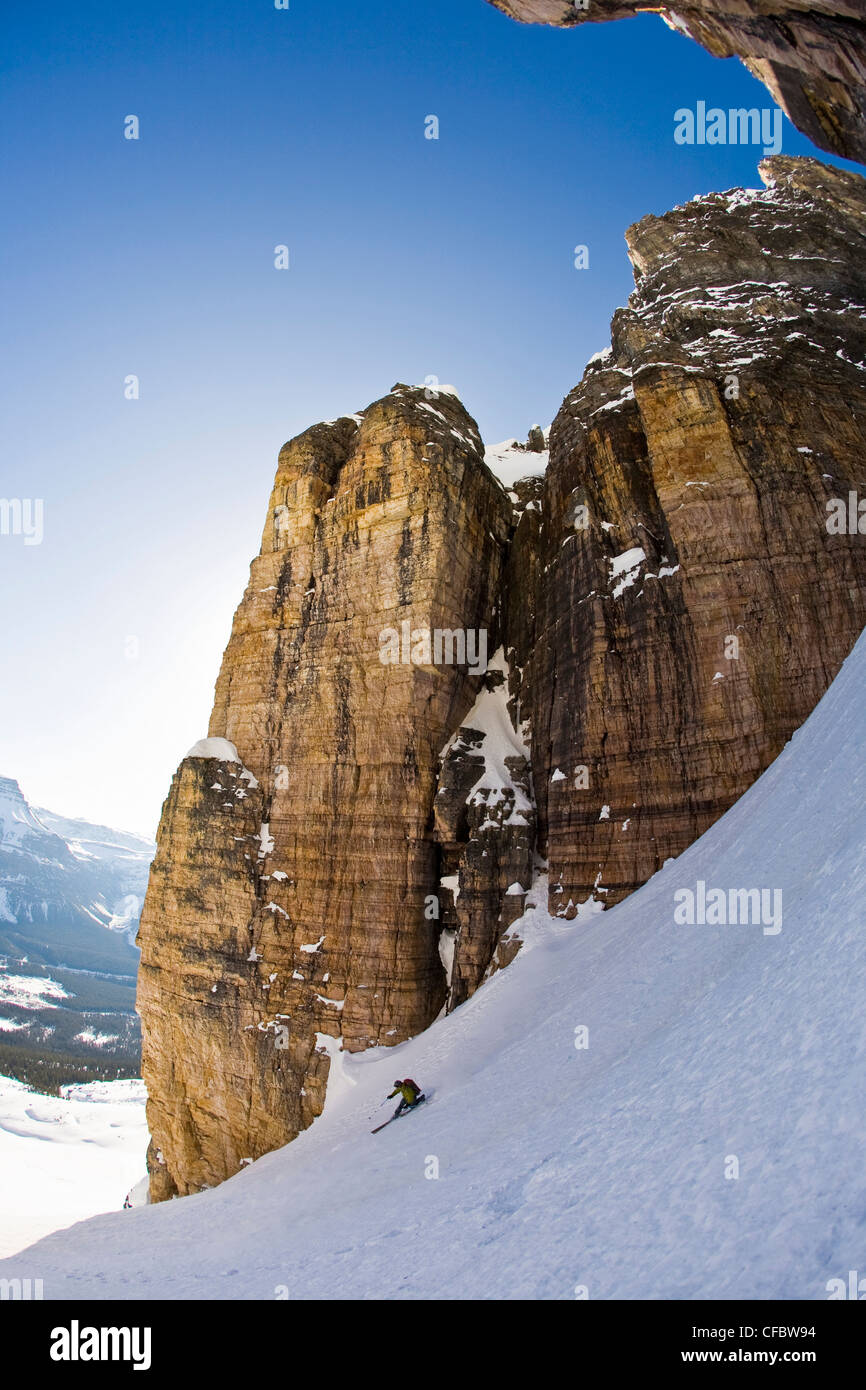 A male backcountry skier skis a couloir on Bow Peak, Icefields Parkway ...