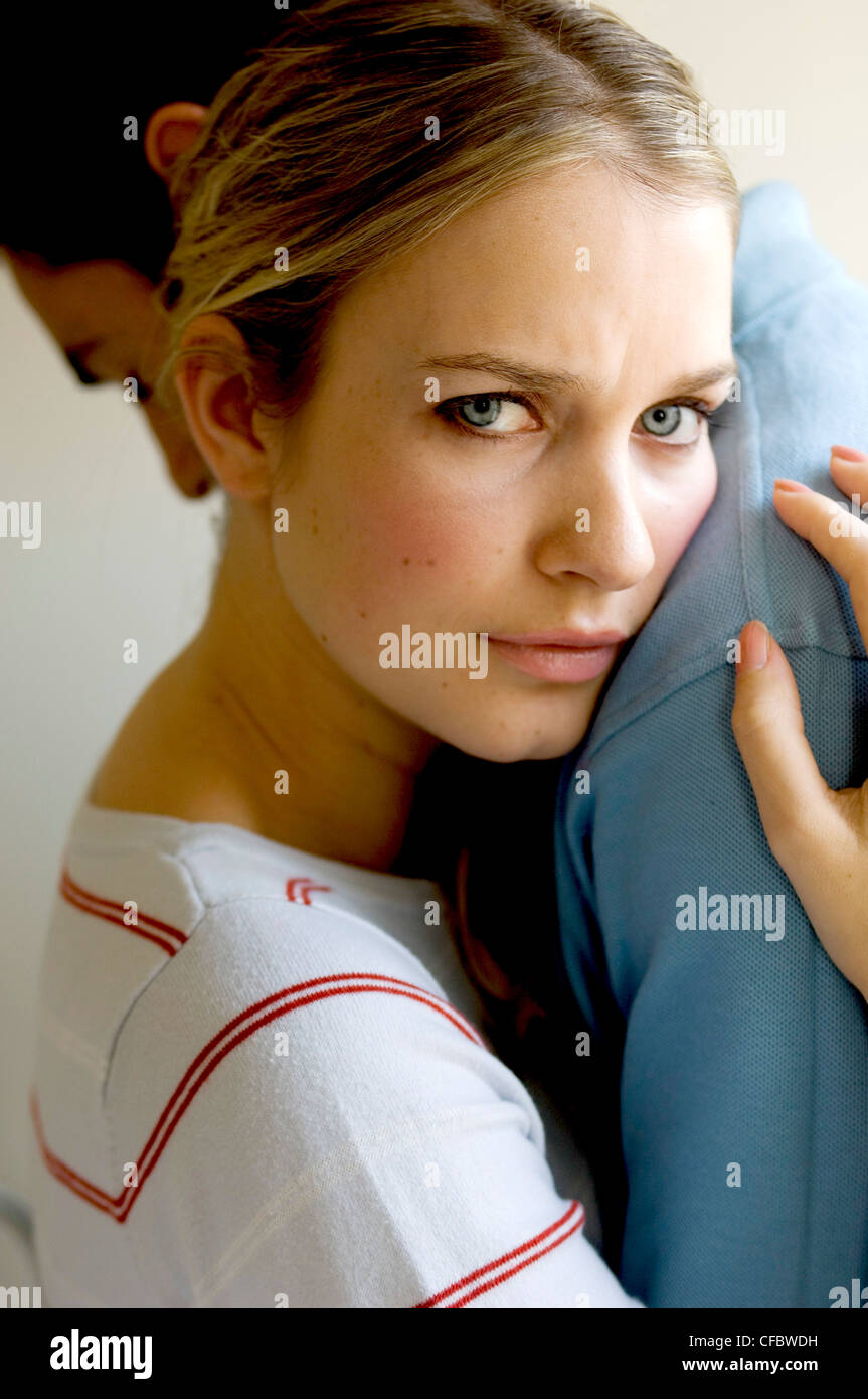 Female leaning head on males shoulder Stock Photo - Alamy