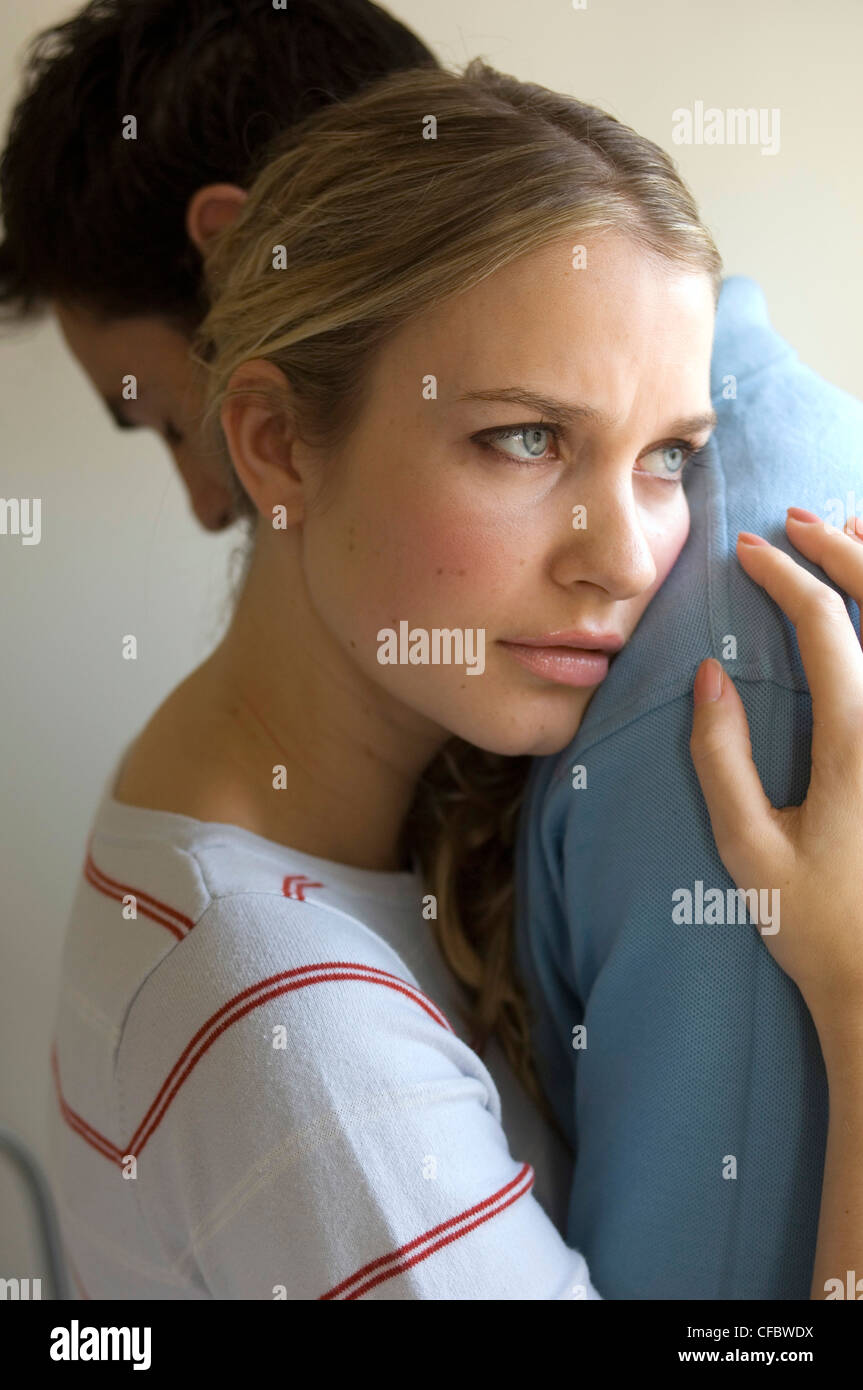 Female leaning head on males shoulder Stock Photo - Alamy