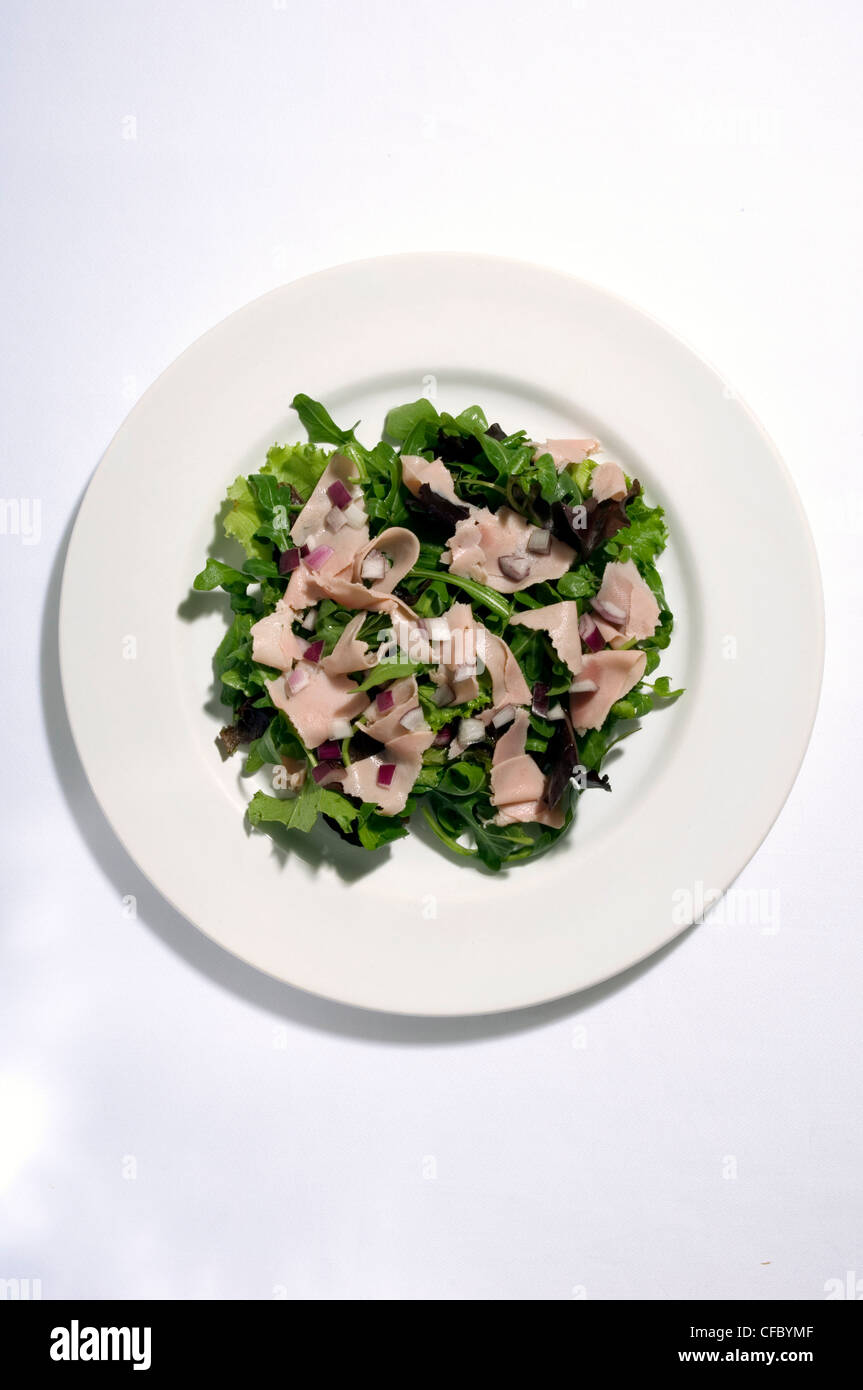 Mixed salad leaves, red onion and torn ham Stock Photo - Alamy