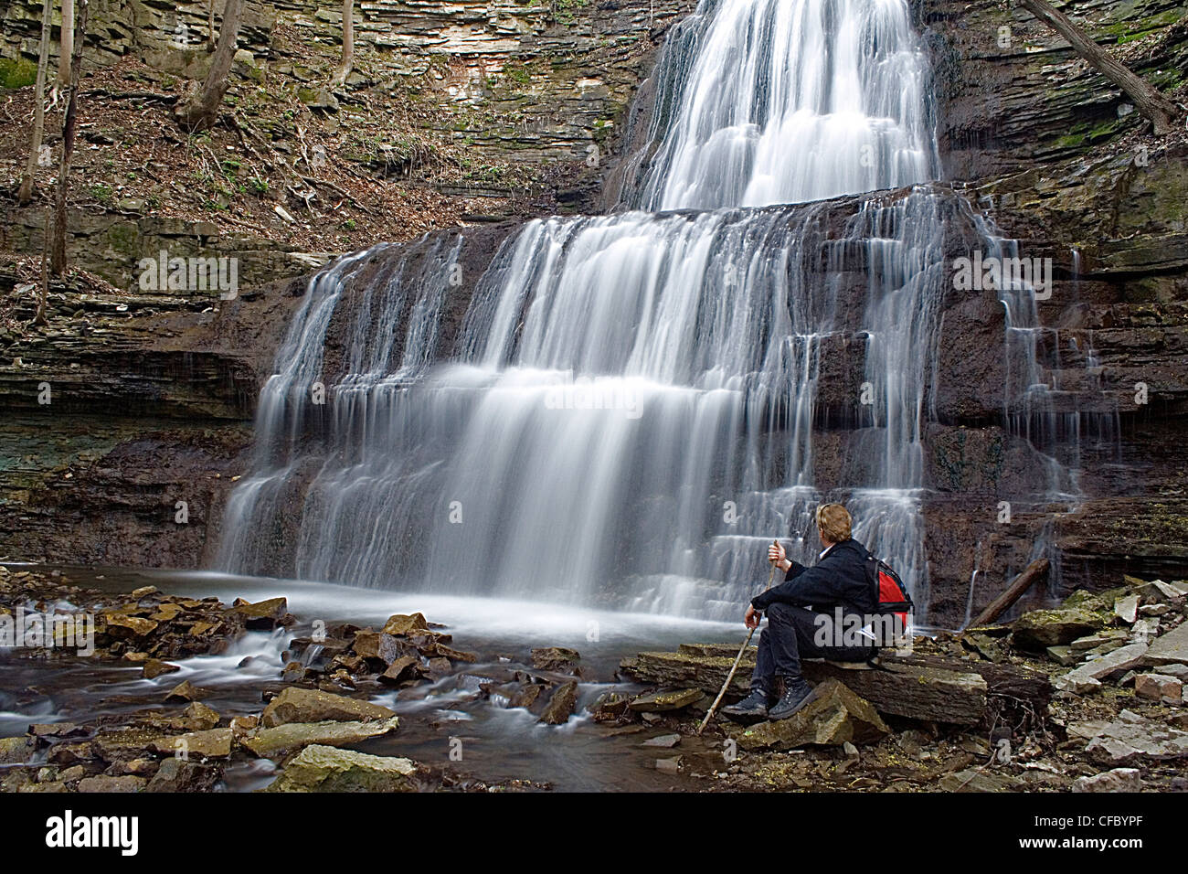 Man sitting by waterfall, Sherman Falls, Ancaster, Hamilton, Ontario ...