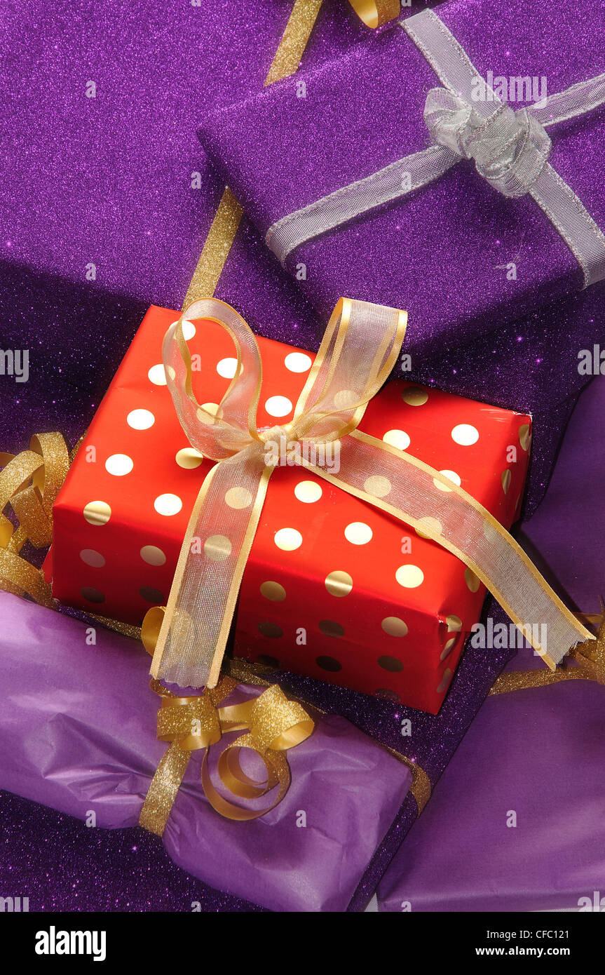 'Odd one out' - a red present amongst lots of purple presents UK Stock ...