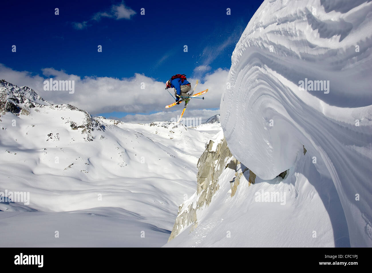 Jumping the cornice at Bralorne Area, near Gold Bridge BC, Canada Stock ...