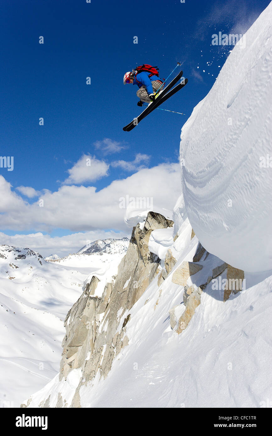 Jumping the cornice at Bralorne Area, near Gold Bridge BC, Canada Stock ...
