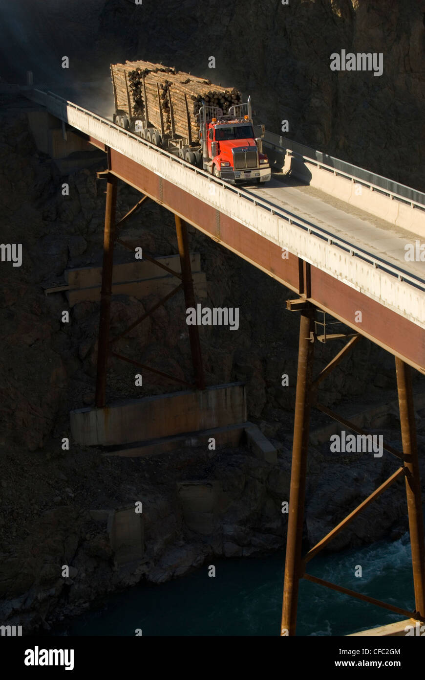 A loaded logging truck crosses the Farwell Canyon bridge, Chilcotin ...