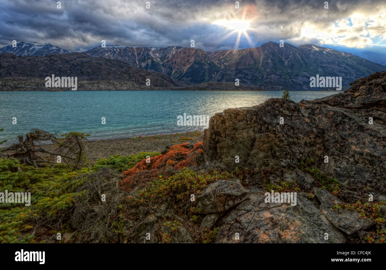 HDR image of setting sun over Atlin Lake, BC. Taken from Sloco Island ...