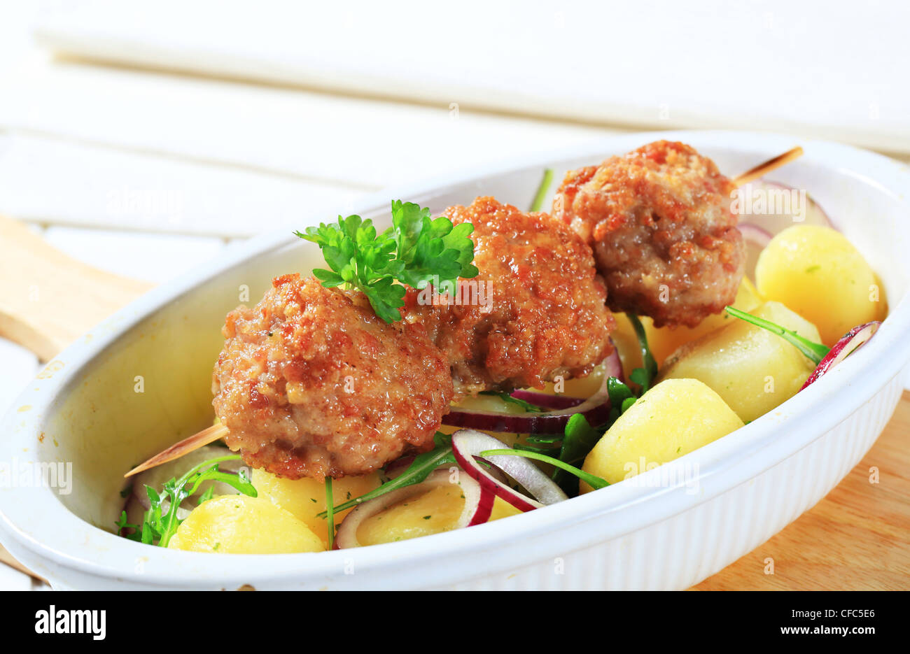 Meatballs on a stick and potatoes Stock Photo - Alamy