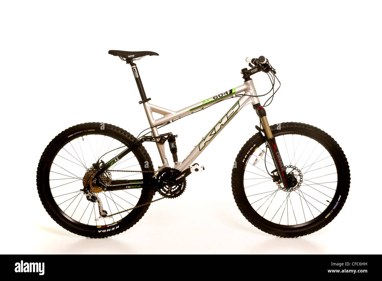 Side view of a mans mountain bike shot in a studio on a white ...