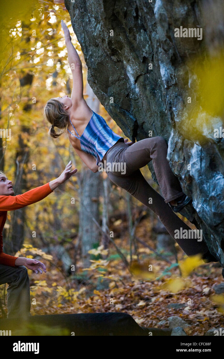 A young couple boulders near the base of Mt Orford, Quebec Stock Photo ...