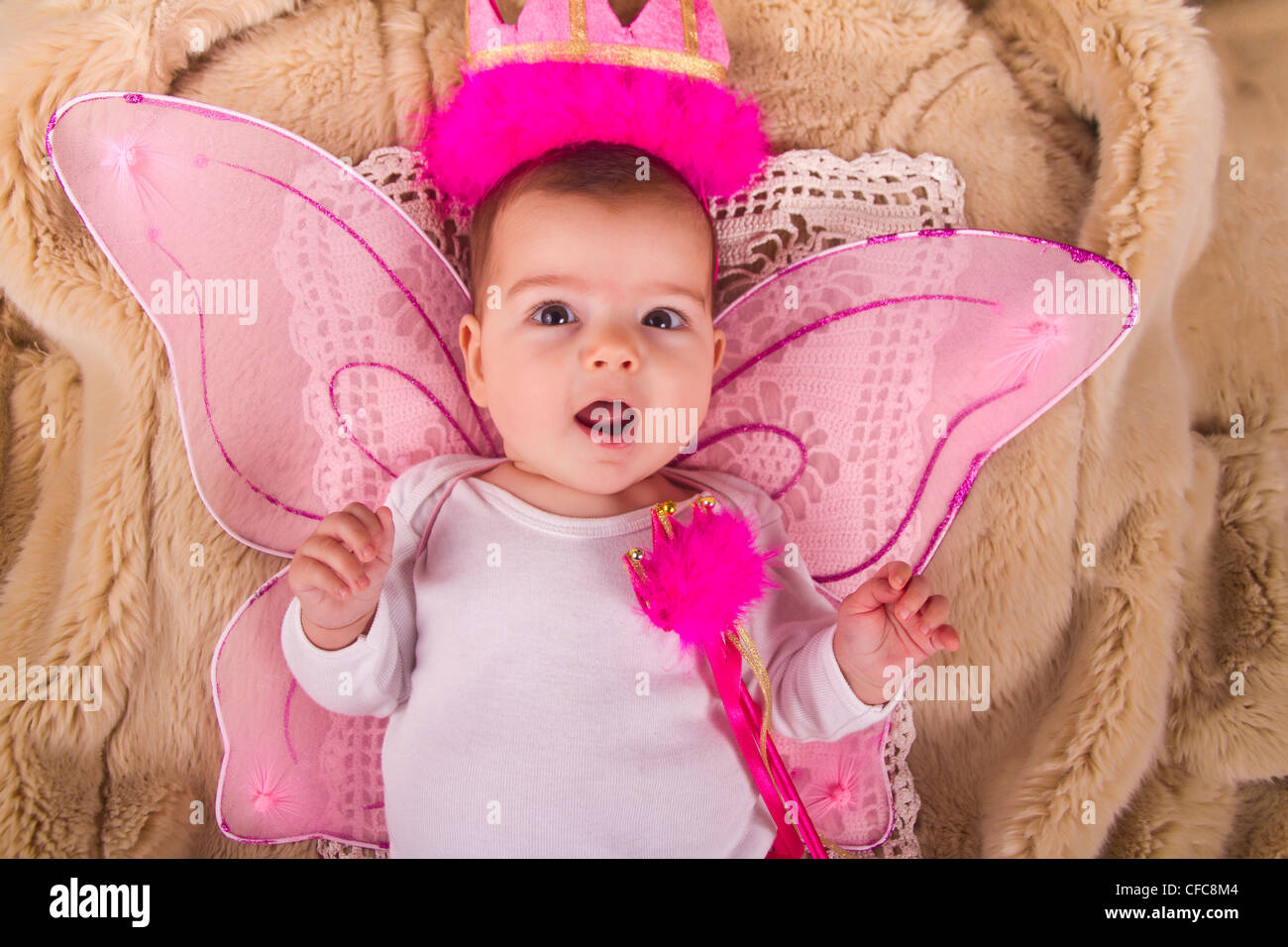 View of a newborn baby with princess hat Stock Photo - Alamy