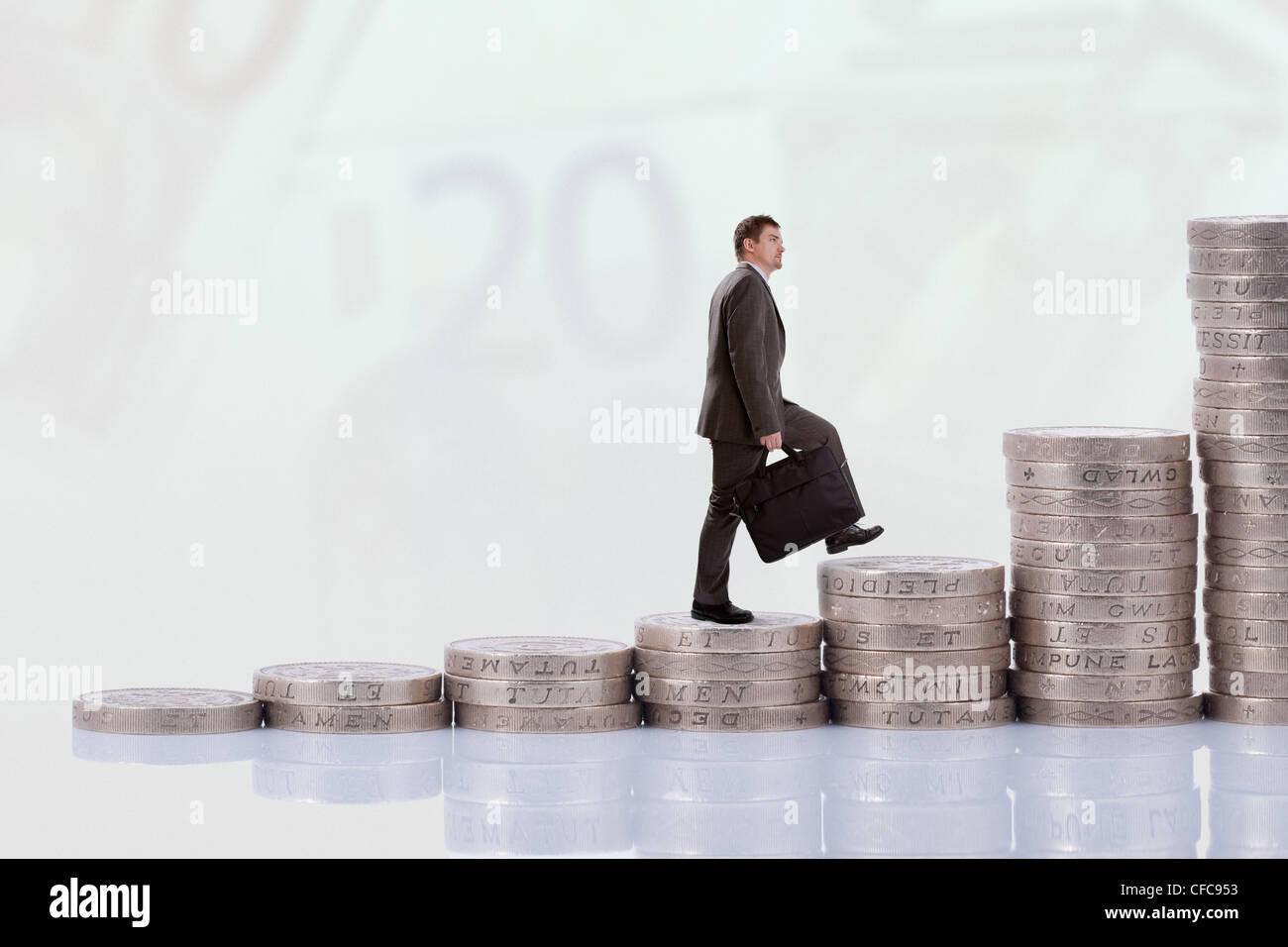 Businessman climbing money stairs, promotion concept Stock Photo - Alamy