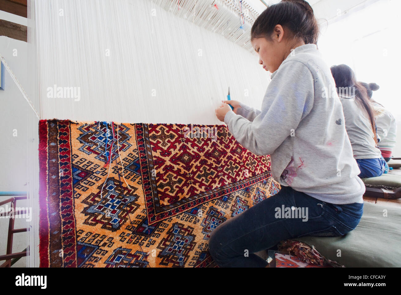Laos, Vientiane, Magic Lao Carpet Handicrafts, Girl Weaving Carpet ...